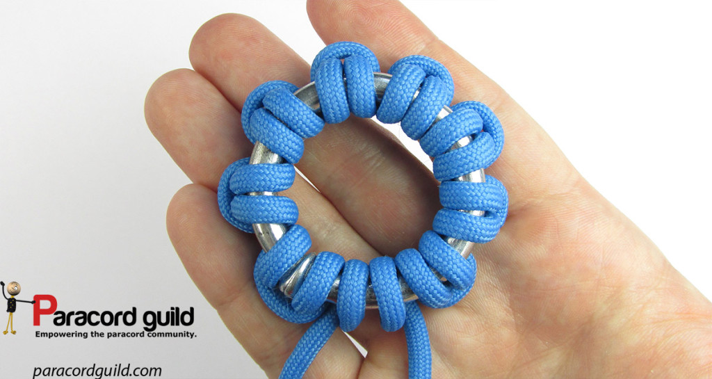 Ringbolt hitching using cow hitches - Paracord guild